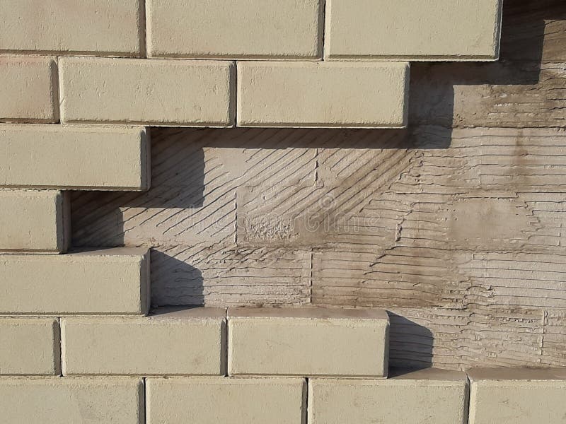 A Brick Wall with Missing Parts Stock Photo - Image of wall, fence ...
