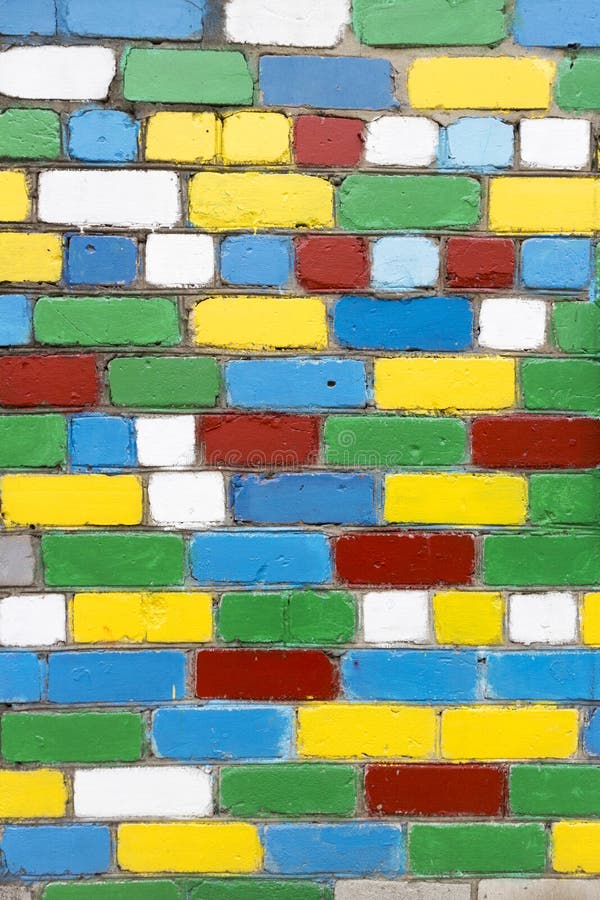 Brick Wall with Painted White, Blue, Green, Red, Yellow Bricks Stock ...