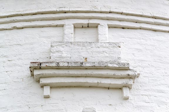 Brick Wall with a Raised Pattern Stock Photo - Image of material, aged ...