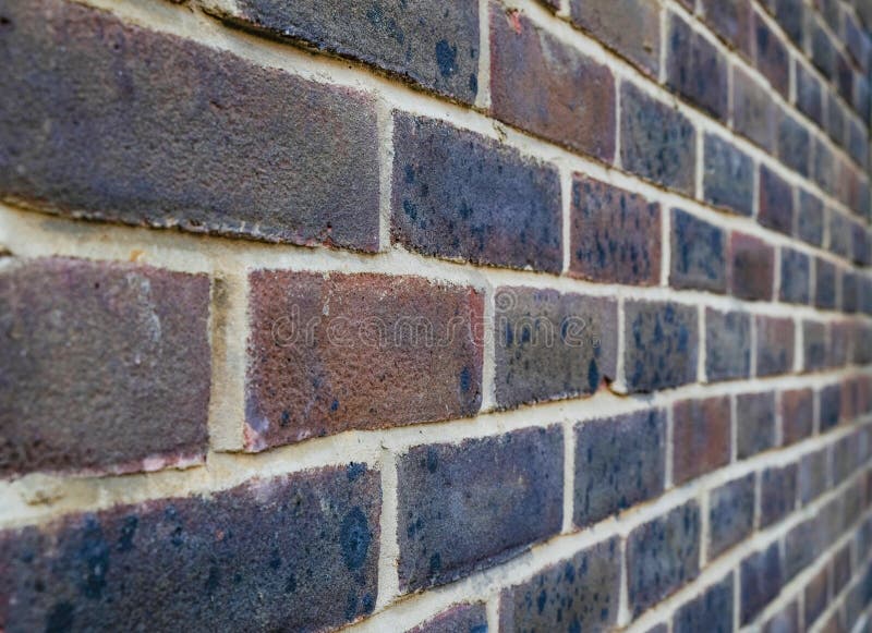 Brick Wall of Red and Purple Stock Bricks in a Horizontal Shot. Stock ...