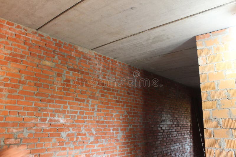 Brick Wall in the Room. Wall Joints in an Unfinished Building Room ...