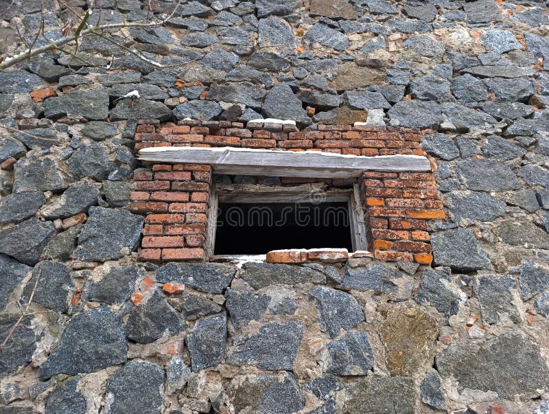 A Brick Wall with a Small Window in it Stock Photo - Image of texture ...