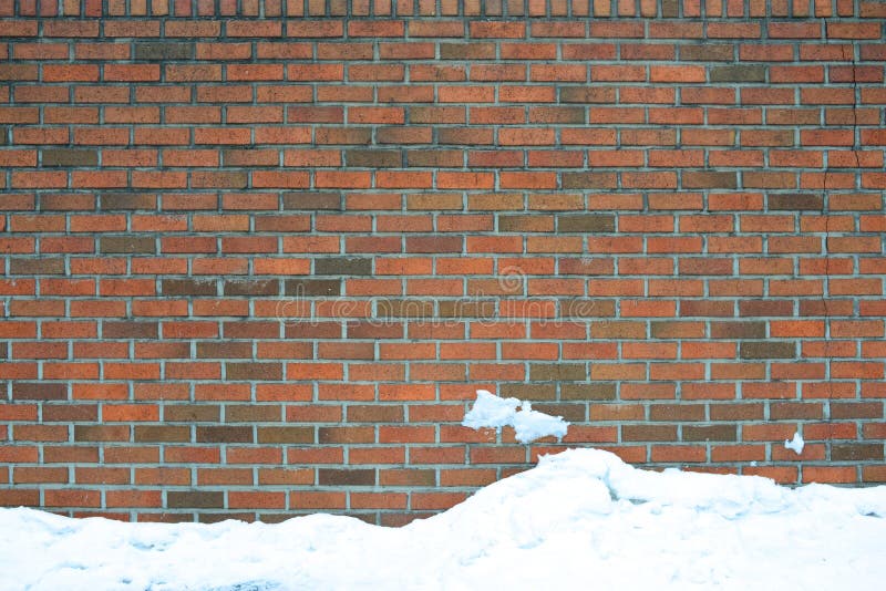 Brick wall with snow stock image. Image of mottled, building - 36998155