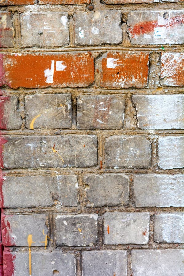 Brick Wall with Some Bricks Pristine and Others Marred, Smudged, or ...