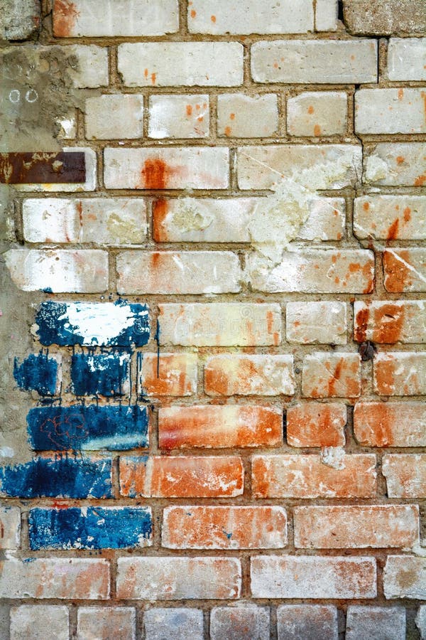 Brick Wall with Some Bricks Pristine and Others Marred, Smudged, or ...