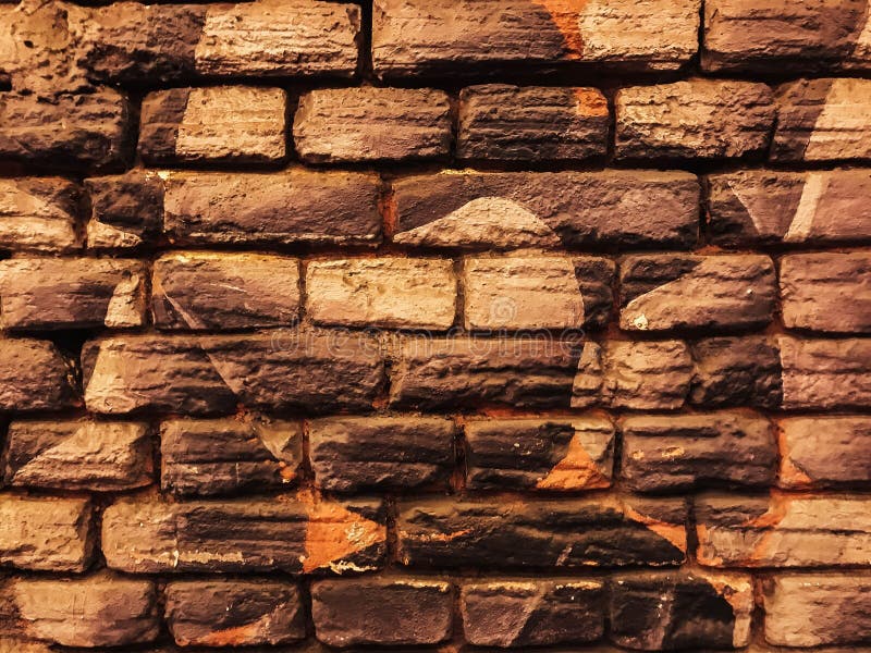 A Brick Wall with a Star and a Leaf on it Stock Image - Image of ...