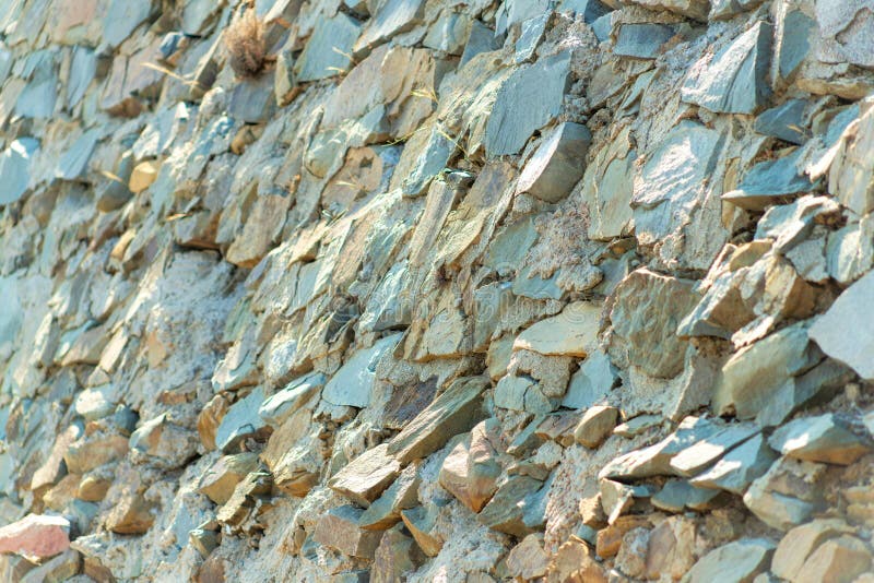 Brick Wall with Stones Selective Focus in Shade Stock Image - Image of ...