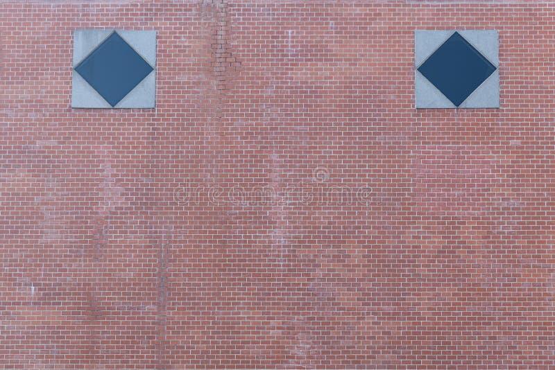 Old Brick Wall with Two Black Window Diamonds Shape Stock Photo - Image ...
