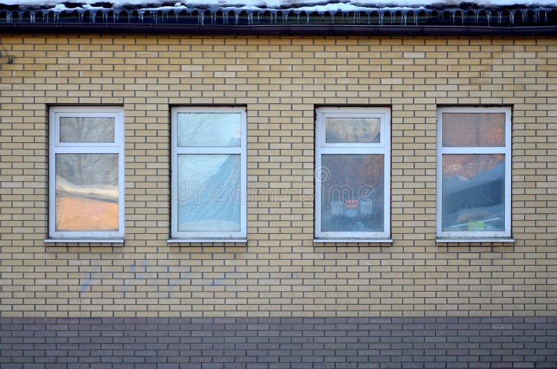 Brick wall with windows stock image. Image of design - 85254175