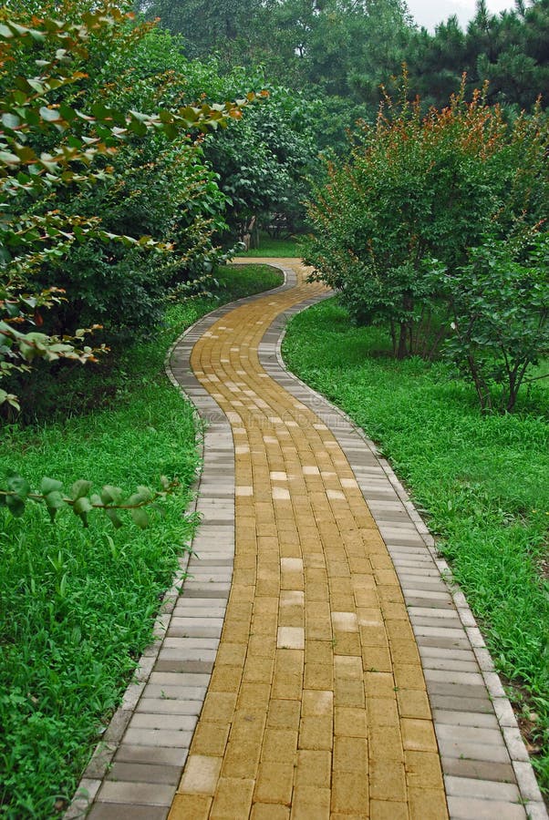 A brick windy garden path stock photo. Image of peaceful - 6778700