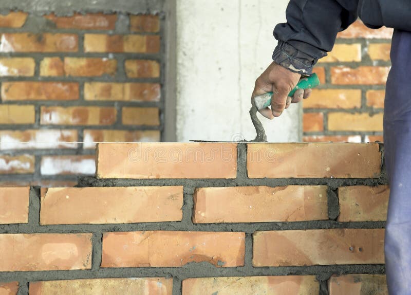 Bricklayer at work stock photo. Image of cement, construction - 5464780