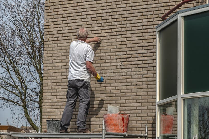 A Bricklayer is Adding the Bricks Editorial Stock Photo - Image of ...
