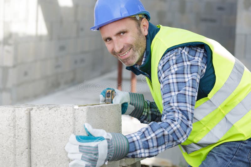 Bricklayer Builder Working with Autoclaved Aerated Concrete Blocks ...
