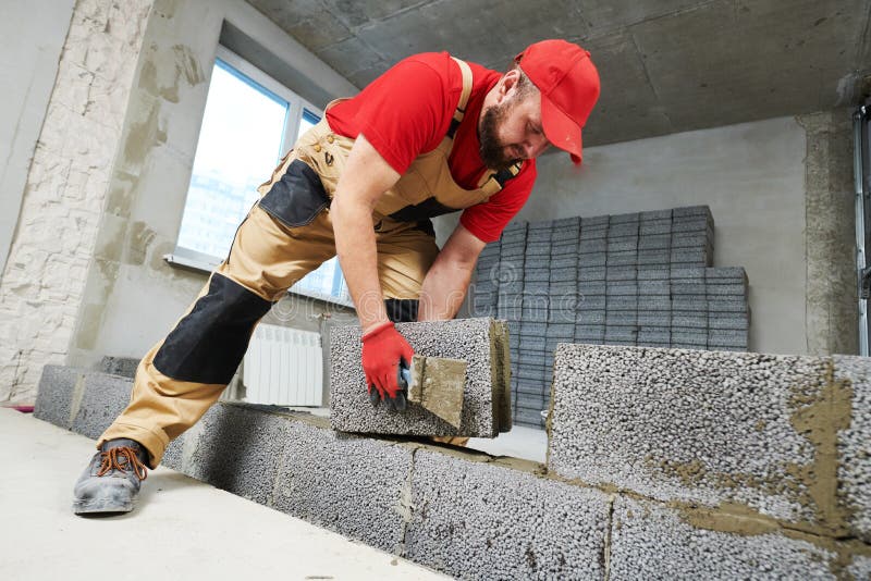 Bricklayer Working with Ceramsite Concrete Blocks. Walling Stock Photo ...