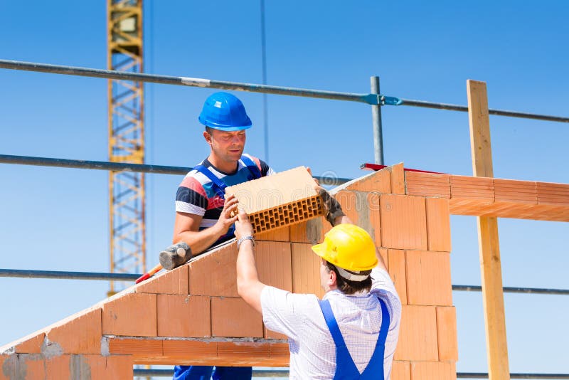 Bricklayer with Brick on Construction Site Stock Photo - Image of ...