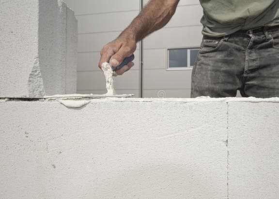 Bricklayer builds the wall stock image. Image of contractors - 10082219