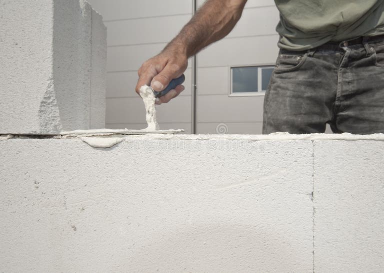 Bricklayer builds the wall stock image. Image of contractors - 10082219