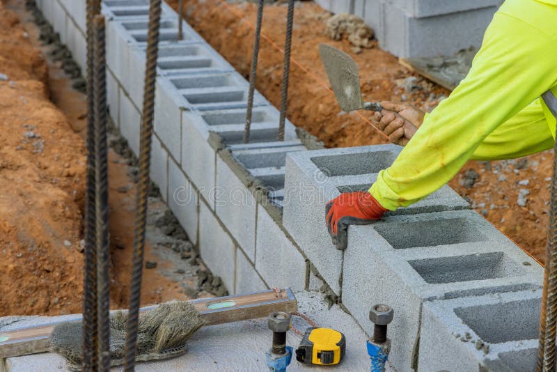 Bricklayer Construction Worker Putting Down Another Row of Cement ...