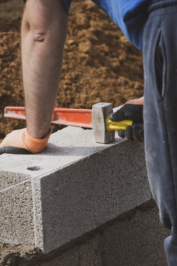 Bricklayer in Glove Spreading Concrete To Build a Wall on Construction ...