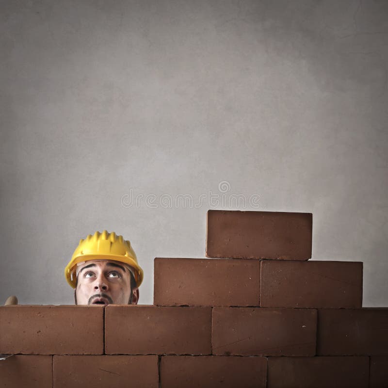 Bricklayer Hiding Behind a Wall Stock Photo - Image of helmet, wall ...
