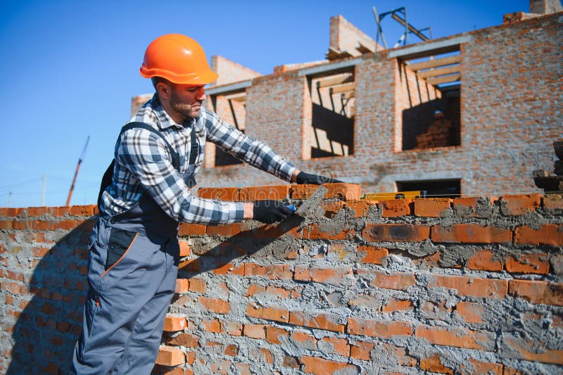 Bricklayer Industrial Worker Installing Brick Masonry on Exterior Wall ...