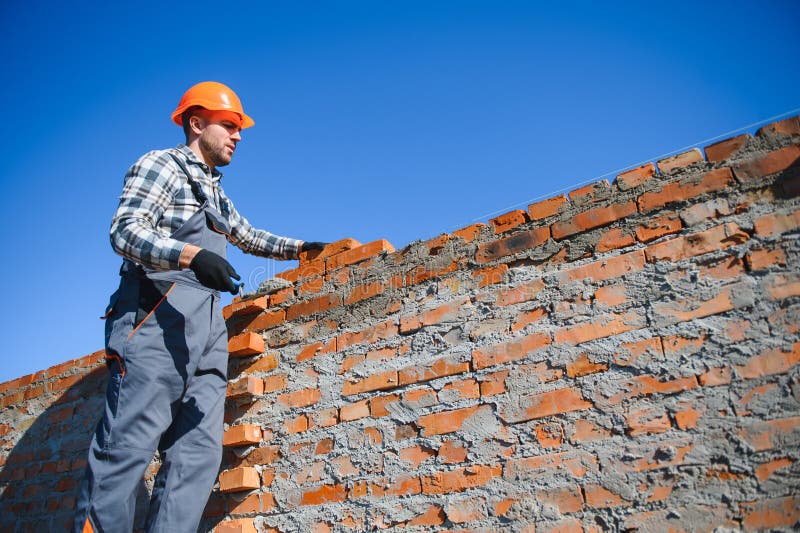 Bricklayer Industrial Worker Installing Brick Masonry on Exterior Wall ...