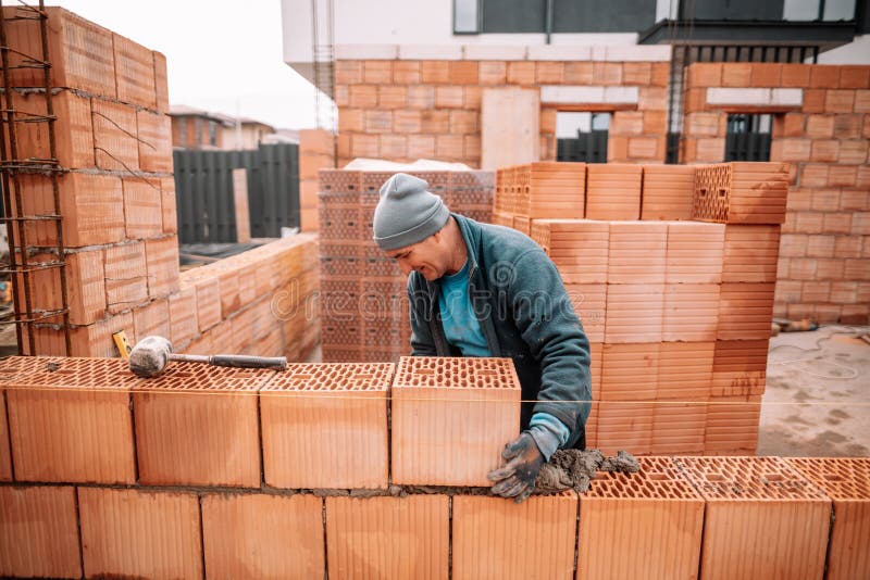 Bricklayer Industrial Worker Installing Old Bricks. Masonry on Exterior ...