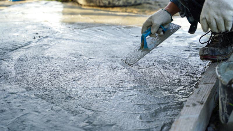 Bricklayer Laying Concrete To Create a Cement Floor Inside the House ...
