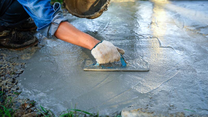 Bricklayer Laying Concrete To Create a Cement Floor Inside the House ...