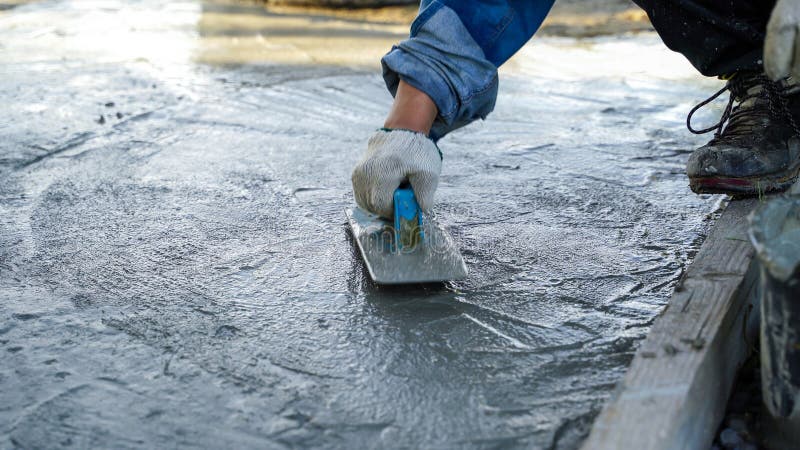 Bricklayer Laying Concrete To Create a Cement Floor Inside the House ...