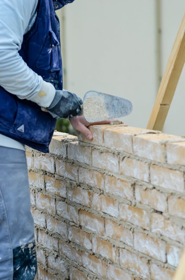 Bricklayer Making a Brick Wall Close-up Stock Image - Image of wall ...