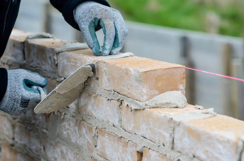 Bricklayer Making a Brick Wall Close-up Stock Photo - Image of ...