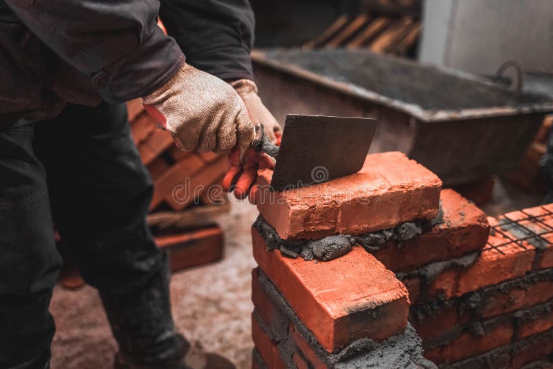Bricklayer Puts Bricks To Make a Wall Stock Image - Image of pouring ...
