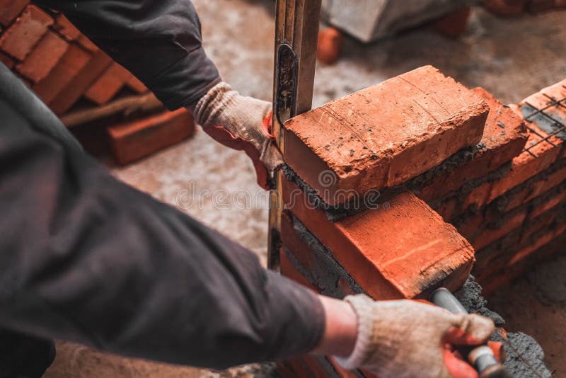 Bricklayer Puts Bricks To Make a Wall Stock Image - Image of industry ...