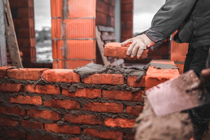 Bricklayer Puts Bricks To Make a Wall Stock Image - Image of business ...