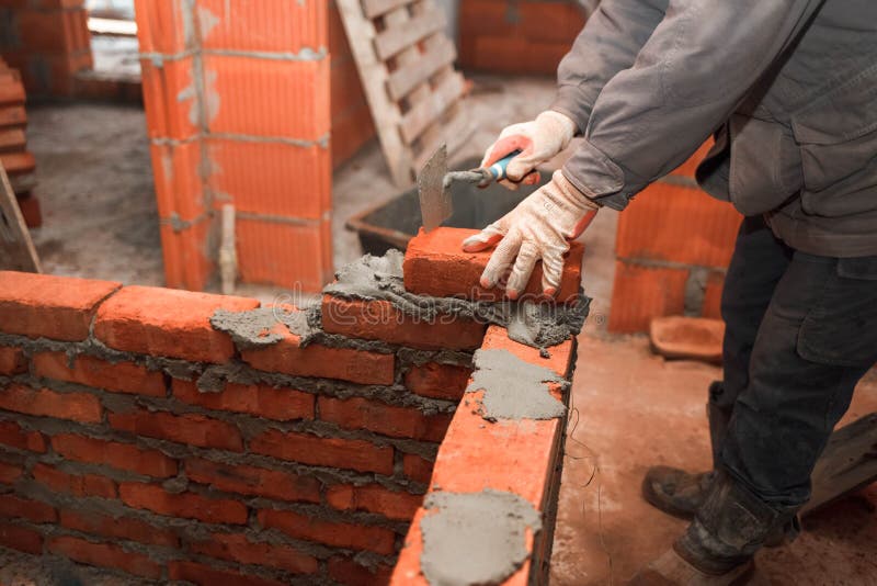 Bricklayer Puts Bricks To Make a Wall Stock Image - Image of house ...