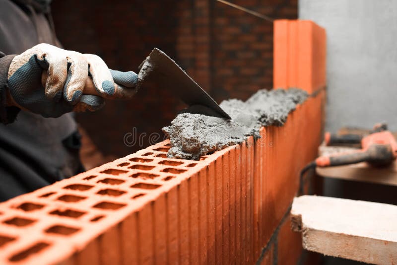 Bricklayer Puts Bricks To Make a Wall Stock Photo - Image of housing ...
