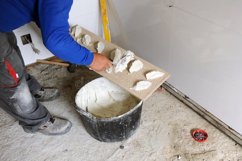 Bricklayer Putting Cement Mortar on Tiles Stock Image - Image of modern ...