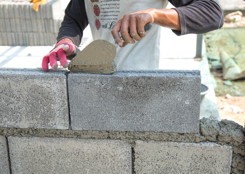 Bricklayer Putting Down Another Row of Bricks in Site Stock Image ...