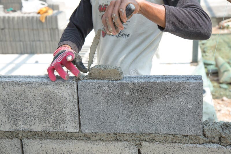 Bricklayer Putting Down Another Row of Bricks in Site Stock Photo ...
