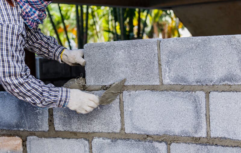 Bricklayer Putting Down Another Row of Bricks in Site Stock Photo ...