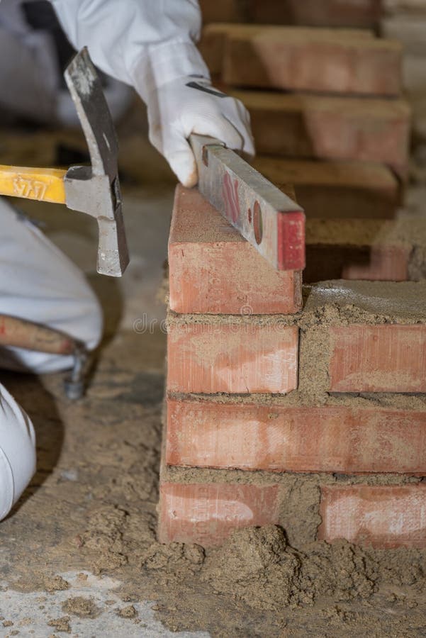 Bricklayer builds the wall stock image. Image of facade - 10082321