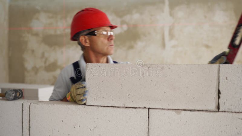Bricklayer Using Spirit Bubble and Laser Level To Precise Check ...