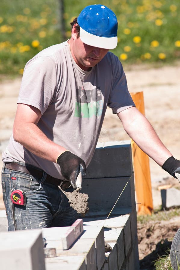 Bricklayer at work stock image. Image of adult, laying - 5464257