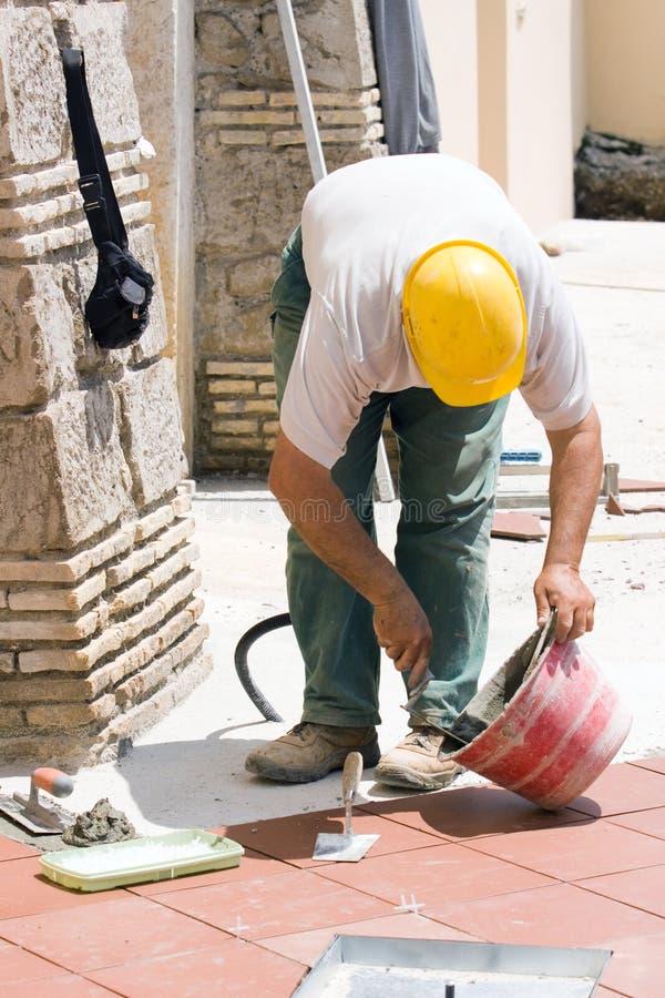 Bricklayer at work stock photo. Image of bricklayer, bricklaying - 91454176