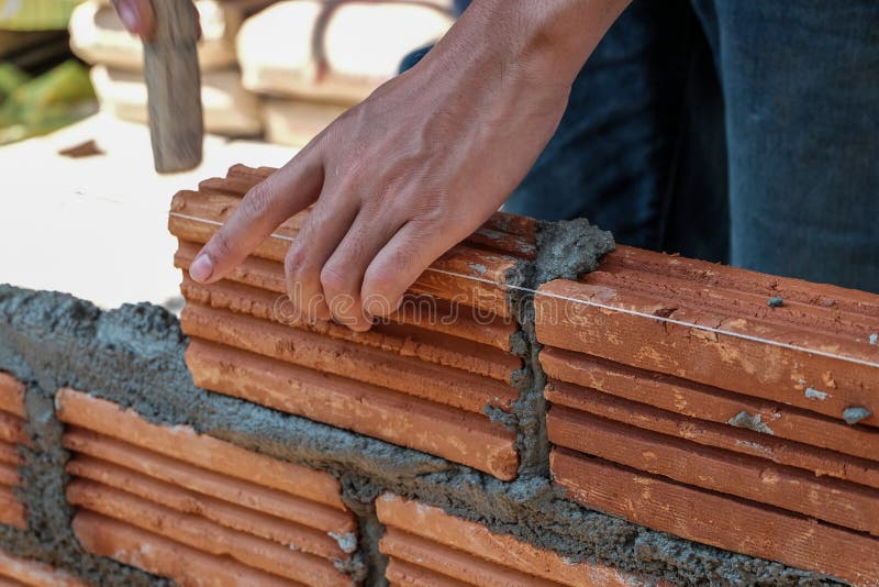 Bricklayer Worker Installing Brick Masonry Stock Photo - Image of ...