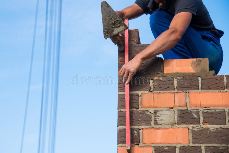 Bricklayer Worker Installing Brick Masonry on Exterior Wall Stock Photo ...
