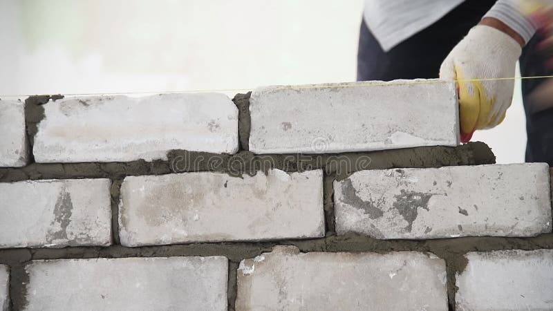 Bricklayer Worker Installing Brick Masonry on Exterior Wall Stock ...