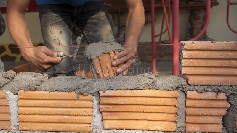 Bricklayer Worker Installing Brick Masonry on Exterior Wall Stock Photo ...