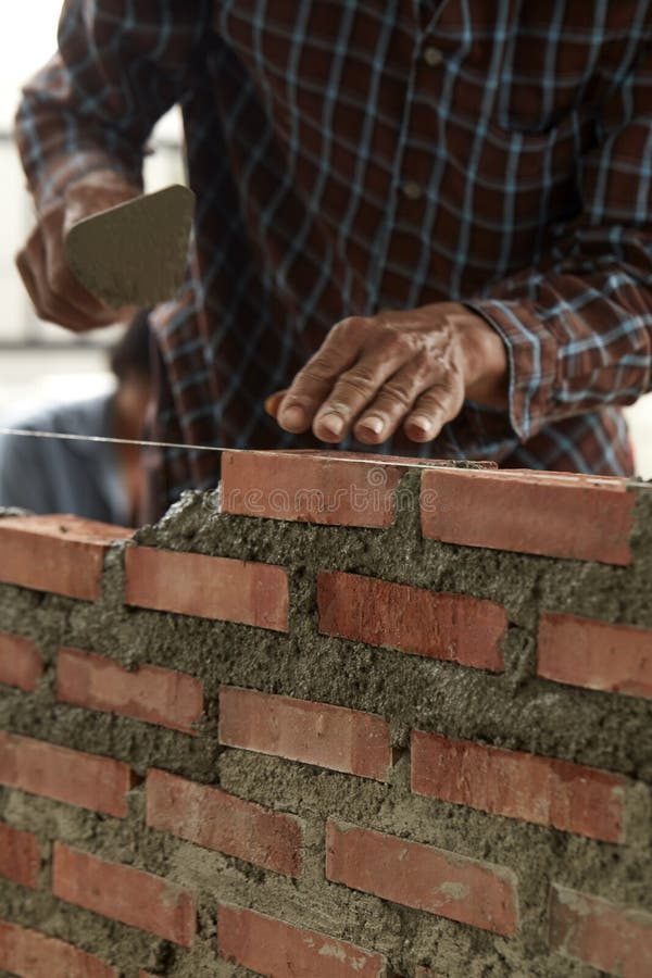 Bricklayer Worker Installing Brick Masonry Stock Photo - Image of ...
